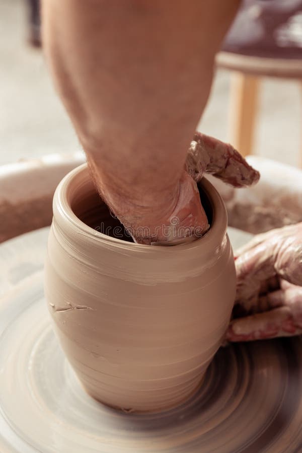 Potter Making a Jar Pot of White Clay on the Potter`s Wheel Circle in ...