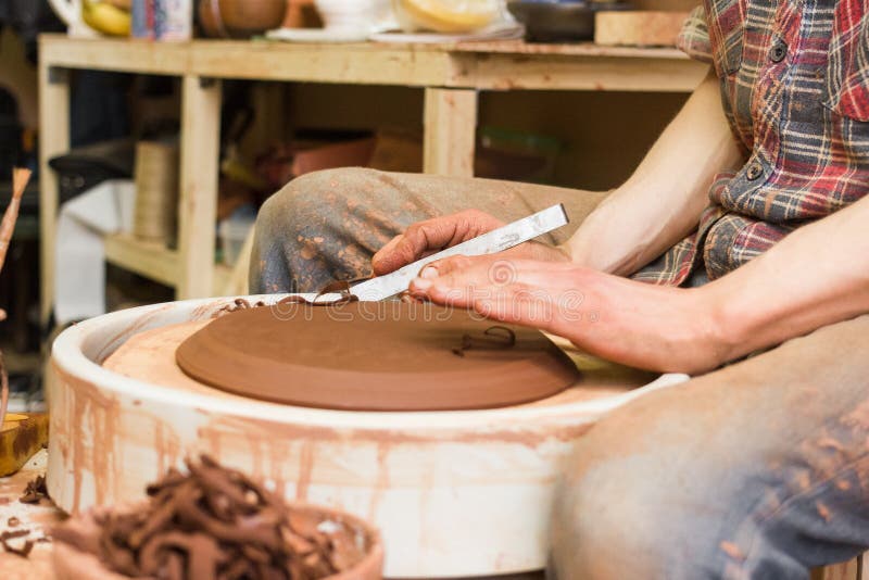 Potter doing his work stock photo. Image of pottery - 102592364