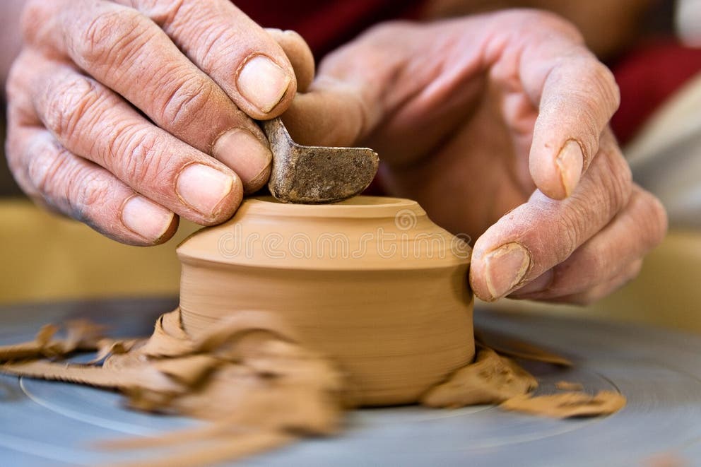 Potter Shaping the Bottom of a Cup on a Spinning Stock Image - Image of ...