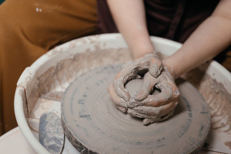 Potter Shaping a Ceramic Artwork on a Wheel. Hands in Clay. Artistic ...