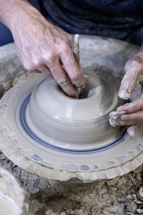 A Potter Throwing a Plate on a Wheel Showing Hands only Stock Photo ...