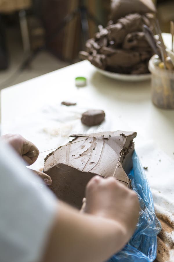 Pottering Concept. Professional Ceramists or Claymakers during a ...