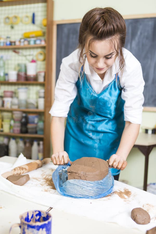 Pottering Ideas and Concepts. Smiling Female Professional Worker ...