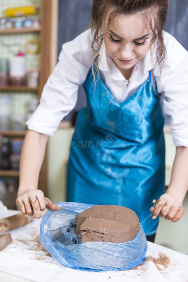 Pottering Ideas and Concepts. Smiling Female Professional Worker ...