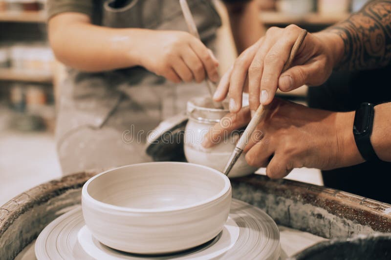 Confident Young Man and Little Boy Making Ceramic Pot on the Pottery ...