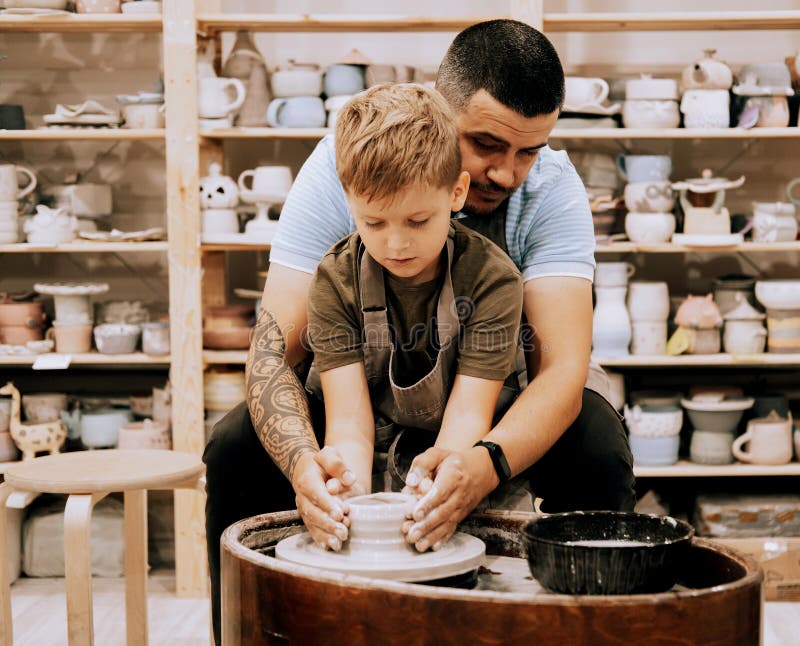 Pottering with Son. Confident Young Man and Little Boy Making Ceramic ...