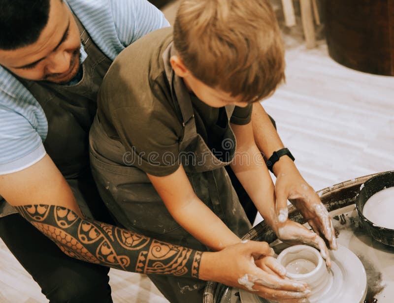 Pottering with Son. Confident Young Man and Little Boy Making Ceramic ...