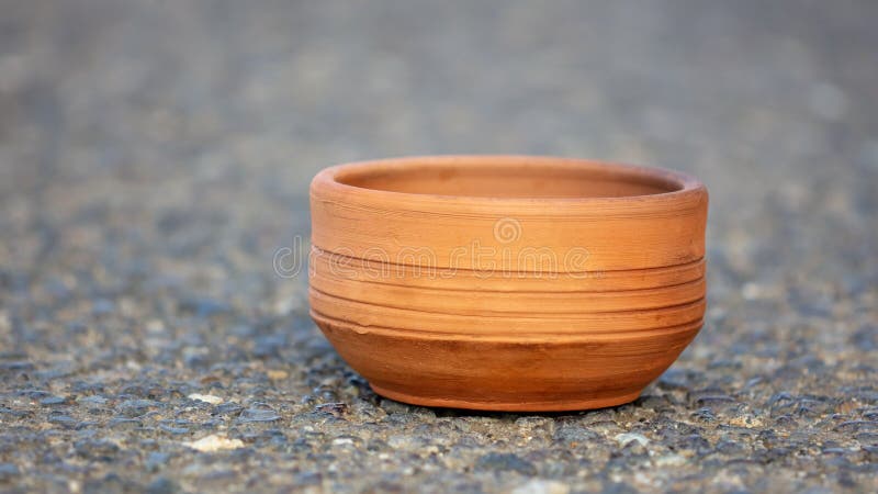 Pottery on an asphalt road stock image. Image of closeup - 172325165