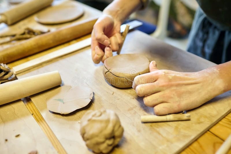Pottery. a Girl with a String in Her Hands Cuts the Clay Stock Image ...