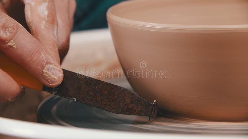 Pottery - the Master is Helping Himself To Remove Excess Clay with a ...