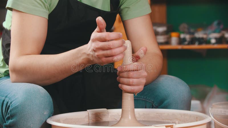 Pottery - Potter Master is Pulling Clay in Length on a Potter`s Wheel ...