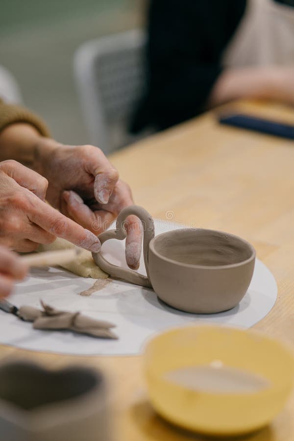 Pottery Student Modeling Clay Mug, Learning Traditional Sculpting ...