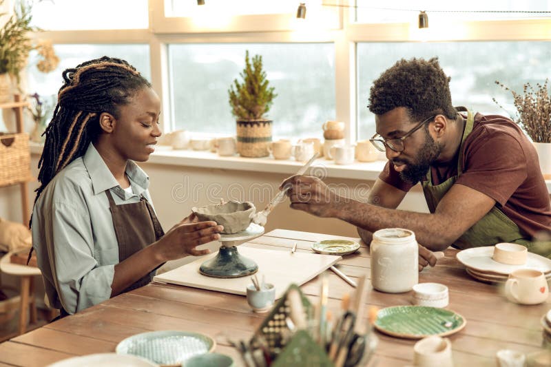 Two People Working with Pottery and Looking Involved Stock Photo ...