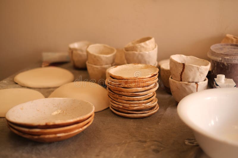 Pottery in the Pottery Workshop: Plates, Cups, Saucers Stock Photo ...