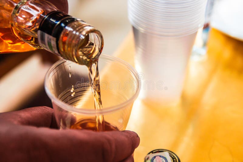 Pour the Alcohol in a Plastic Disposable Dishes. Stock Image - Image of ...
