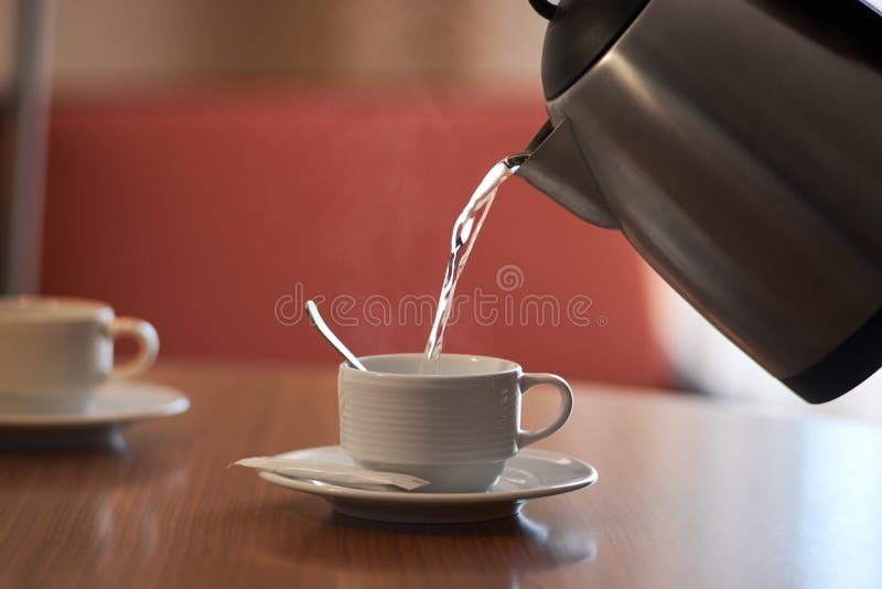 Pour Boiling Water from the Kettle into the Cup Stock Image - Image of ...