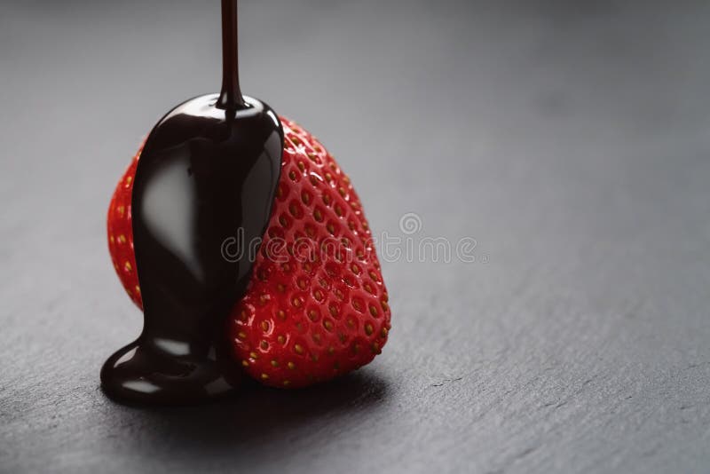 Pour Chocolate Over Ripe Strawberry on Slate Background Stock Photo ...