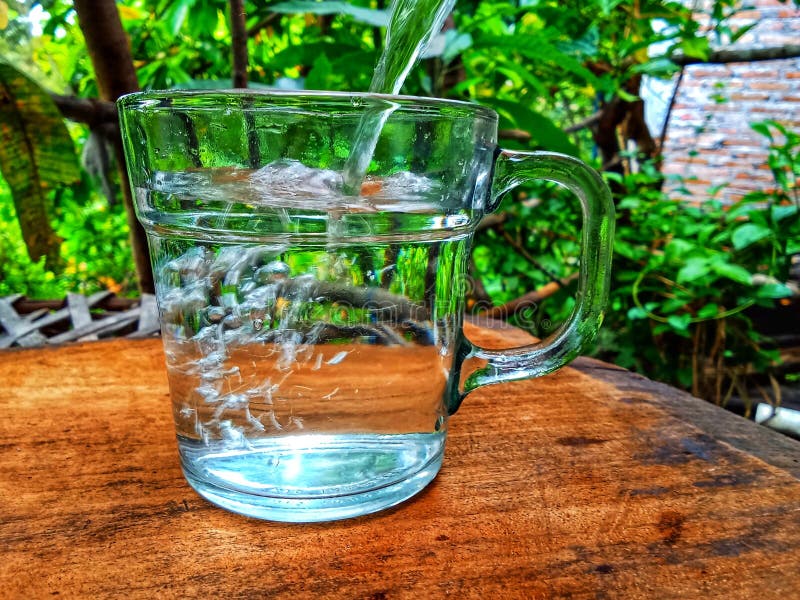 Pour Drinking Water in a Glass . Stock Image - Image of aqua, drinking ...