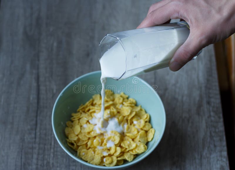 Milk is Poured into a Flake Dish Stock Photo - Image of eating, cuisine ...
