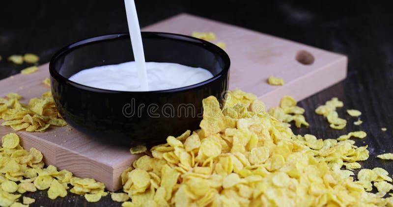 Pour Milk for Dry Breakfast Corn Flakes Yellow Stock Video - Video of ...