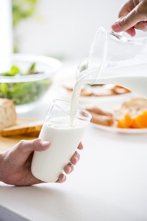 Continuous Pouring of Breakfast Milk Stock Photo - Image of milk ...