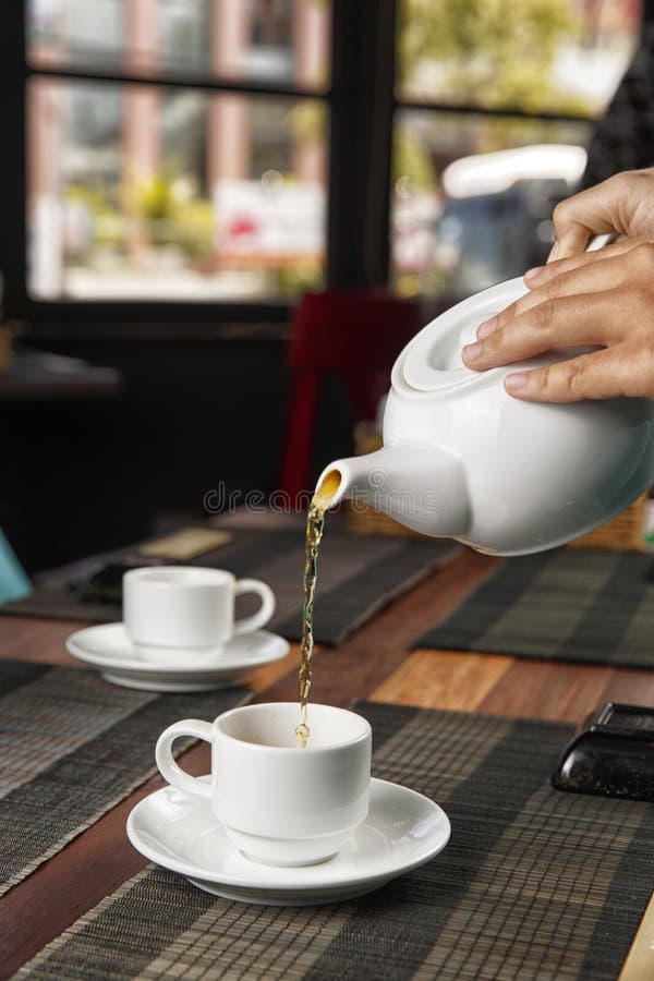 Pour Tea from a Teapot into a Cup Stock Image - Image of health, china ...