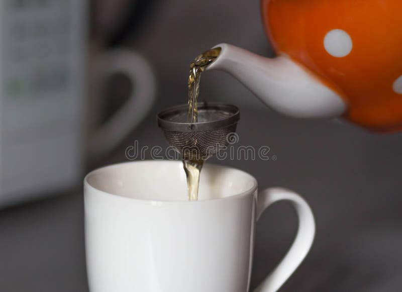 Pour Tea from the Teapot through a Sieve. Tea Party Stock Photo - Image ...