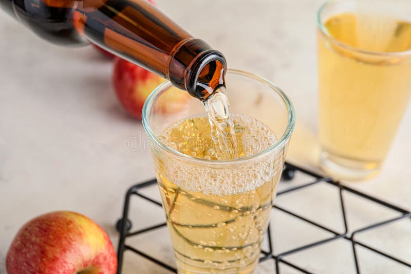 Pouring of Apple Cider into Glass on Table Stock Photo - Image of ...