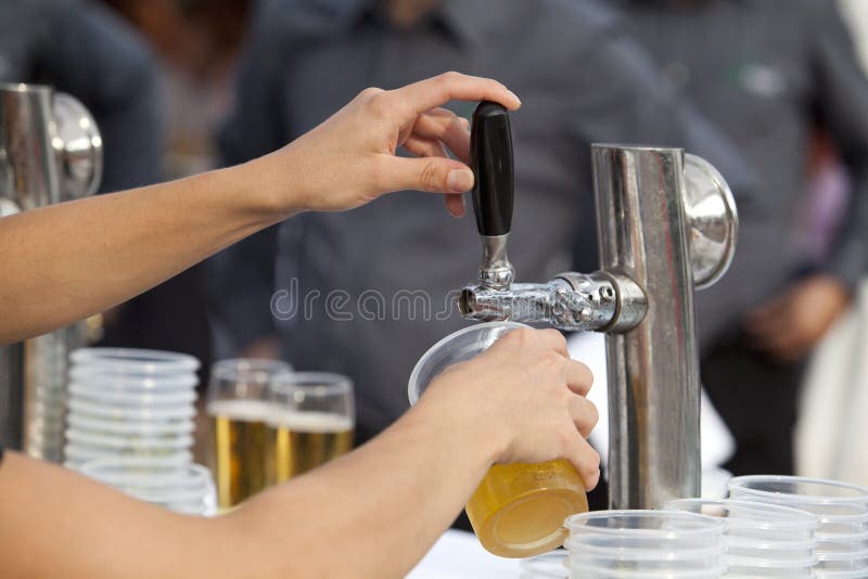 Pouring a beer stock photo. Image of drink, lather, barman - 29130344