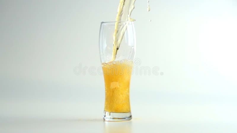Pouring Beer into a Glass. Pouring Beer into a Glass. Macro View of ...