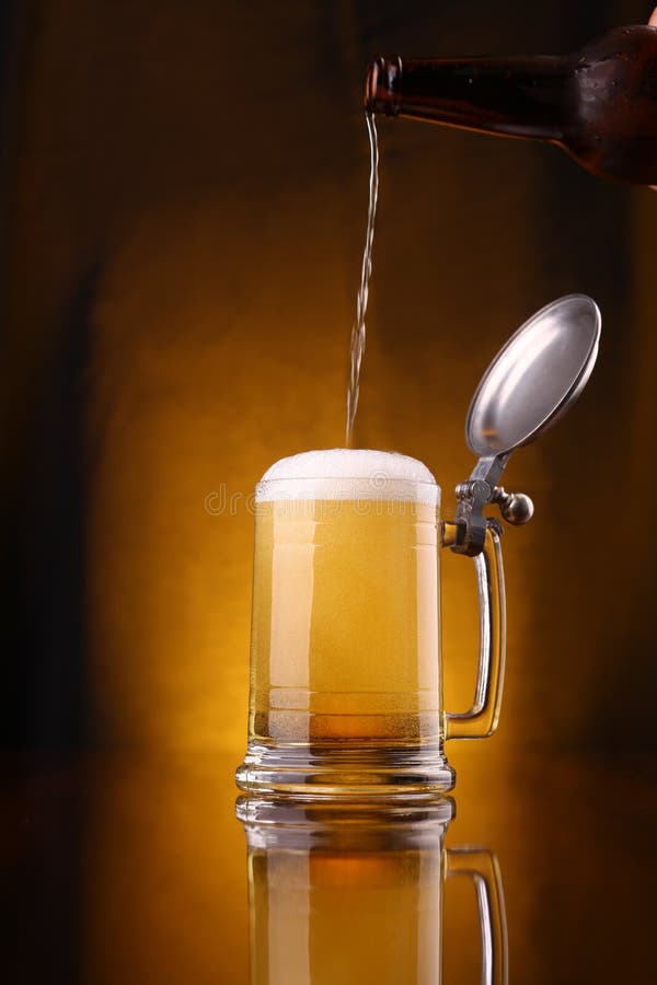Pouring beer stock photo. Image of brewing, beer, bottle - 42409884