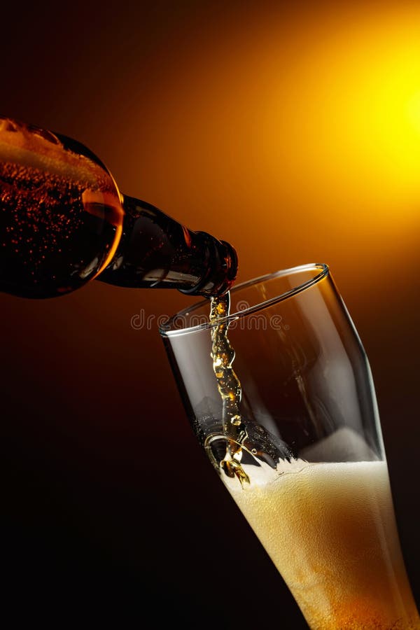 Pouring Beer into a Tall Glass Stock Photo - Image of brew, brewed ...