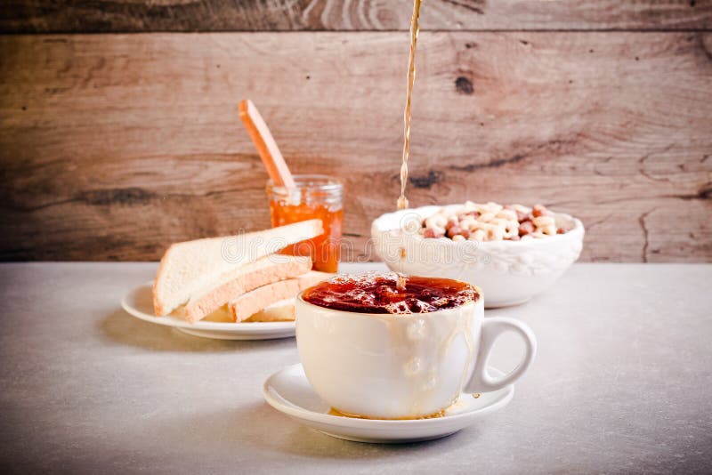 Pouring black tea into cup stock image. Image of drink - 78464161