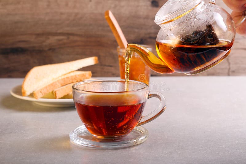 Pouring Black Tea in To Glass Stock Photo - Image of adding, rustic ...