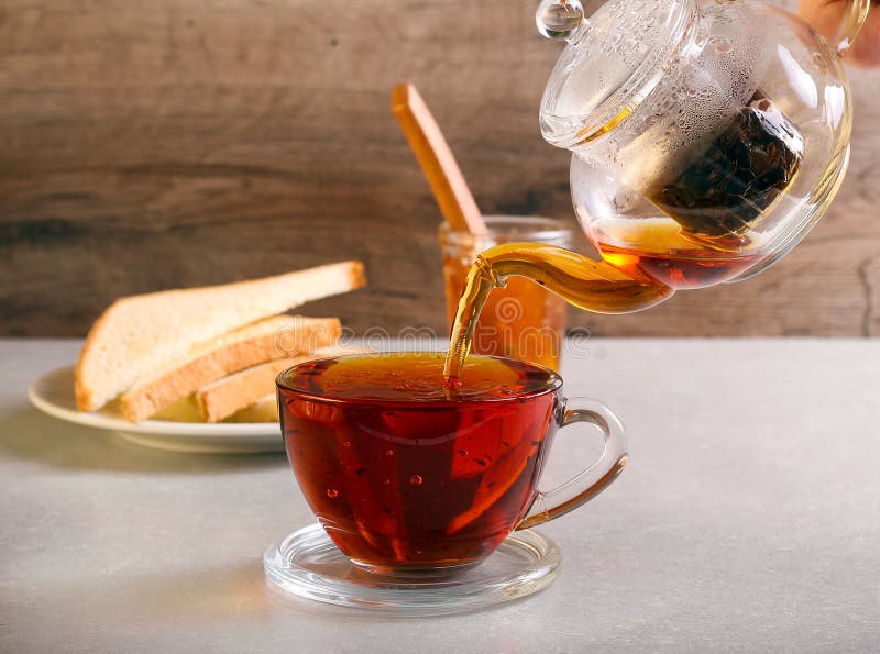 Pouring Black Tea in To Transparent Glass Stock Image - Image of ...