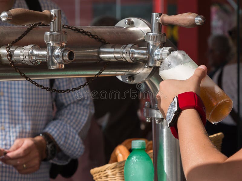 Pouring a Blonde Beer from the Tap, Pull a Pint Stock Photo - Image of ...