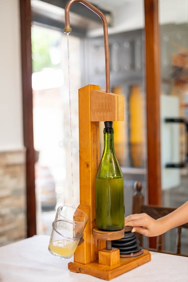 Pouring a Bottle of Cider with a Cider Pourer Stock Image - Image of ...