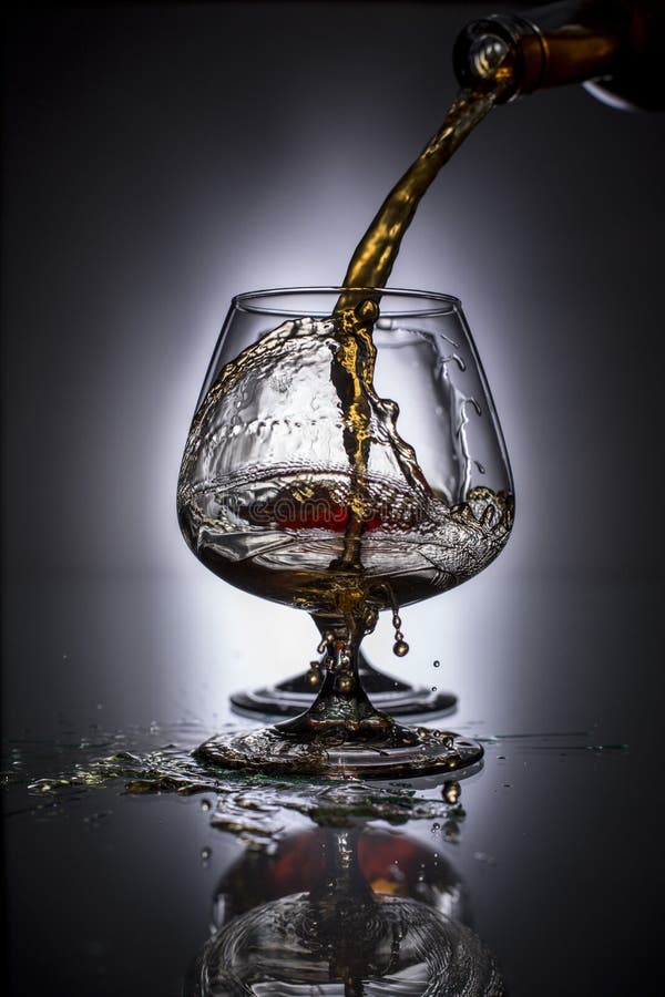 Pouring Brandy into a Glass Stock Image - Image of beautiful, brown ...