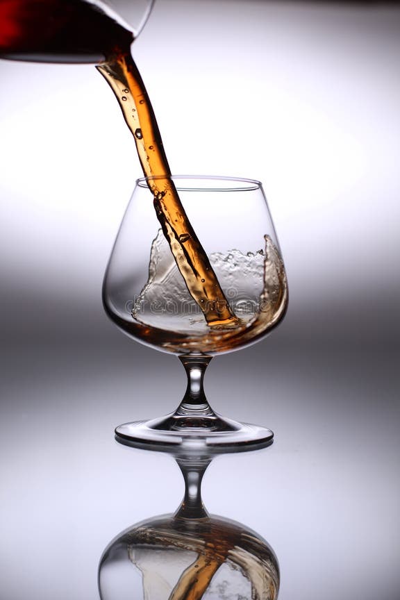Pouring Brandy into a Glass Stock Photo - Image of orange, exquisite ...