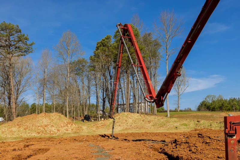 Pouring Cement Concrete for the Foundation of a Building Using an ...