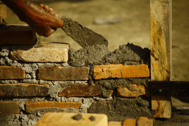 Builder layering bricks stock photo. Image of engineer - 38149878