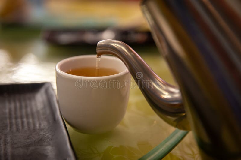 Pouring Chinese Tea stock photo. Image of sharing, buffet - 371738936