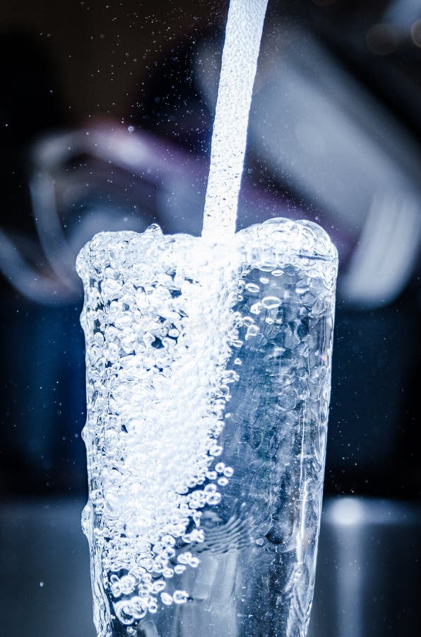 Pouring Clean Safe Drinking Water from Tap Pipe Home Stock Photo ...