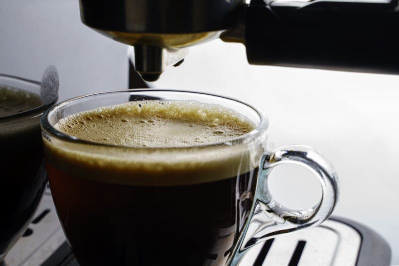 Pouring Coffee into the Coffee Cup Close Up.Automatic Coffee Machine ...