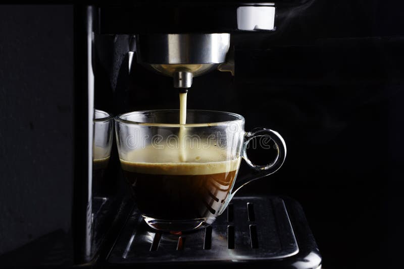 Pouring Coffee into the Coffee Cup Close Up.Automatic Coffee Machine ...