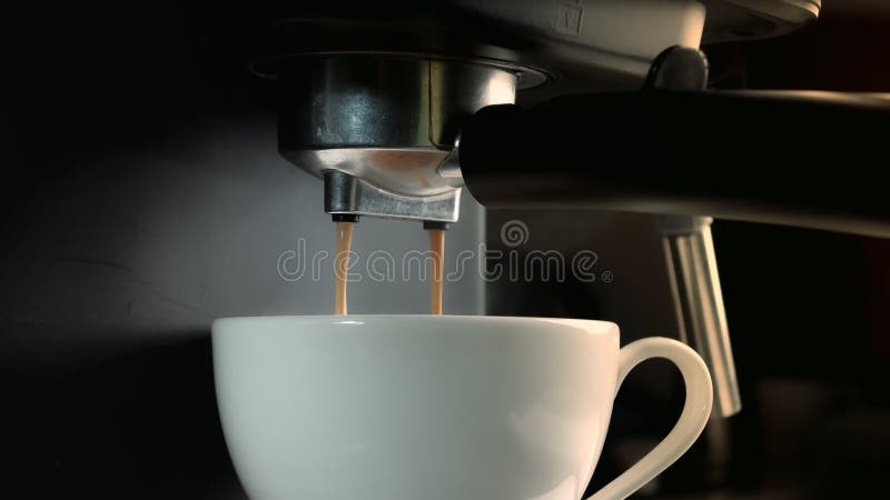 Pouring Coffee Stream from Machine in Cup. Flowing Fresh Ground Coffee ...