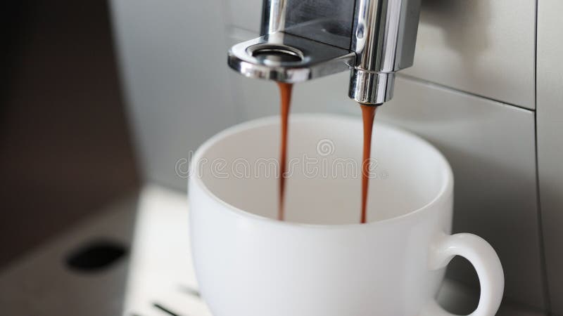 Pouring Coffee Stream from Machine in Cup. Home Making Hot Espresso ...