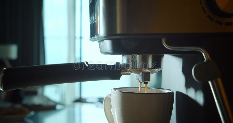 Pouring Coffee Stream from Machine in Cup. Home Making Hot Espresso ...