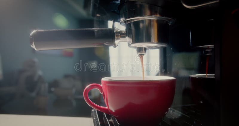 Pouring Coffee Stream from Machine in Red Cup. Home Making Hot Espresso ...