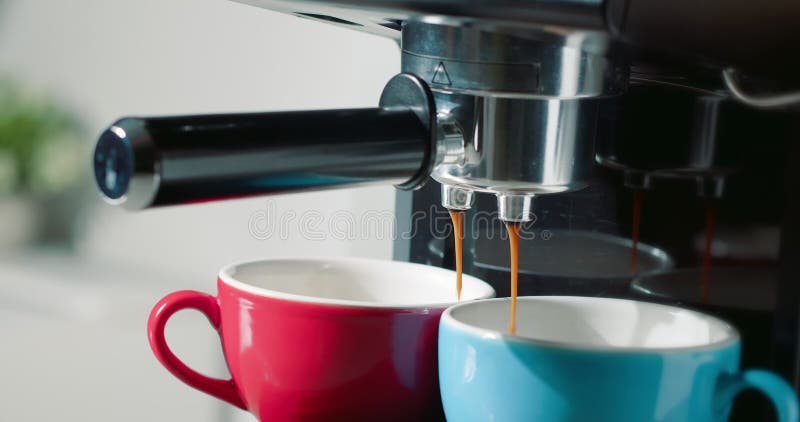 Pouring Coffee Stream from Machine in Cups. Home Making Hot Espresso ...